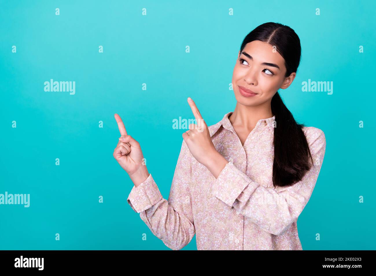 Portrait of attractive positive filipino girl look direct fingers empty ...