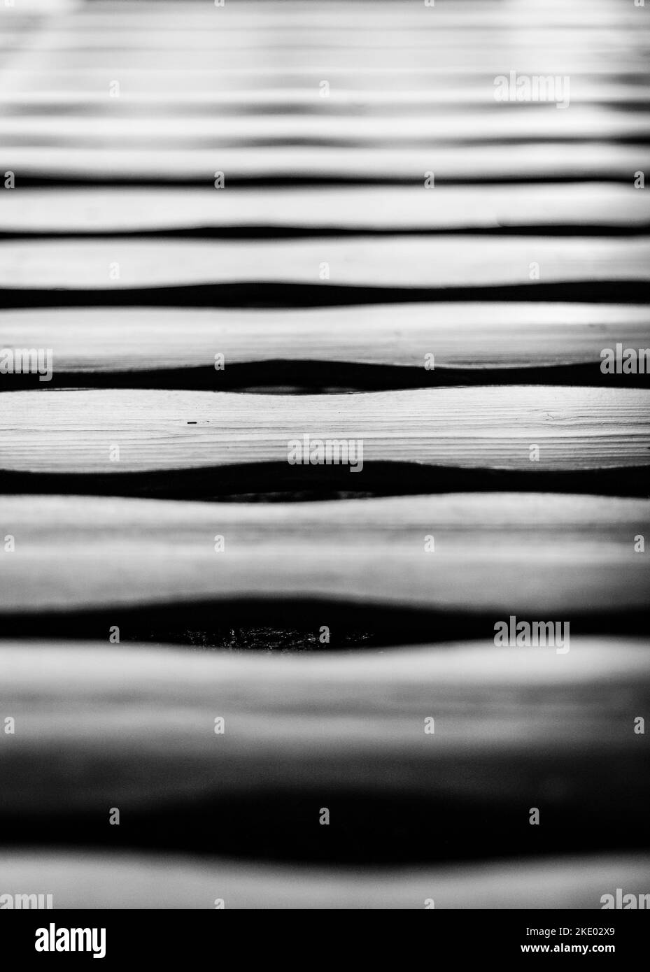 A vertical grayscale of wooden planks Stock Photo - Alamy