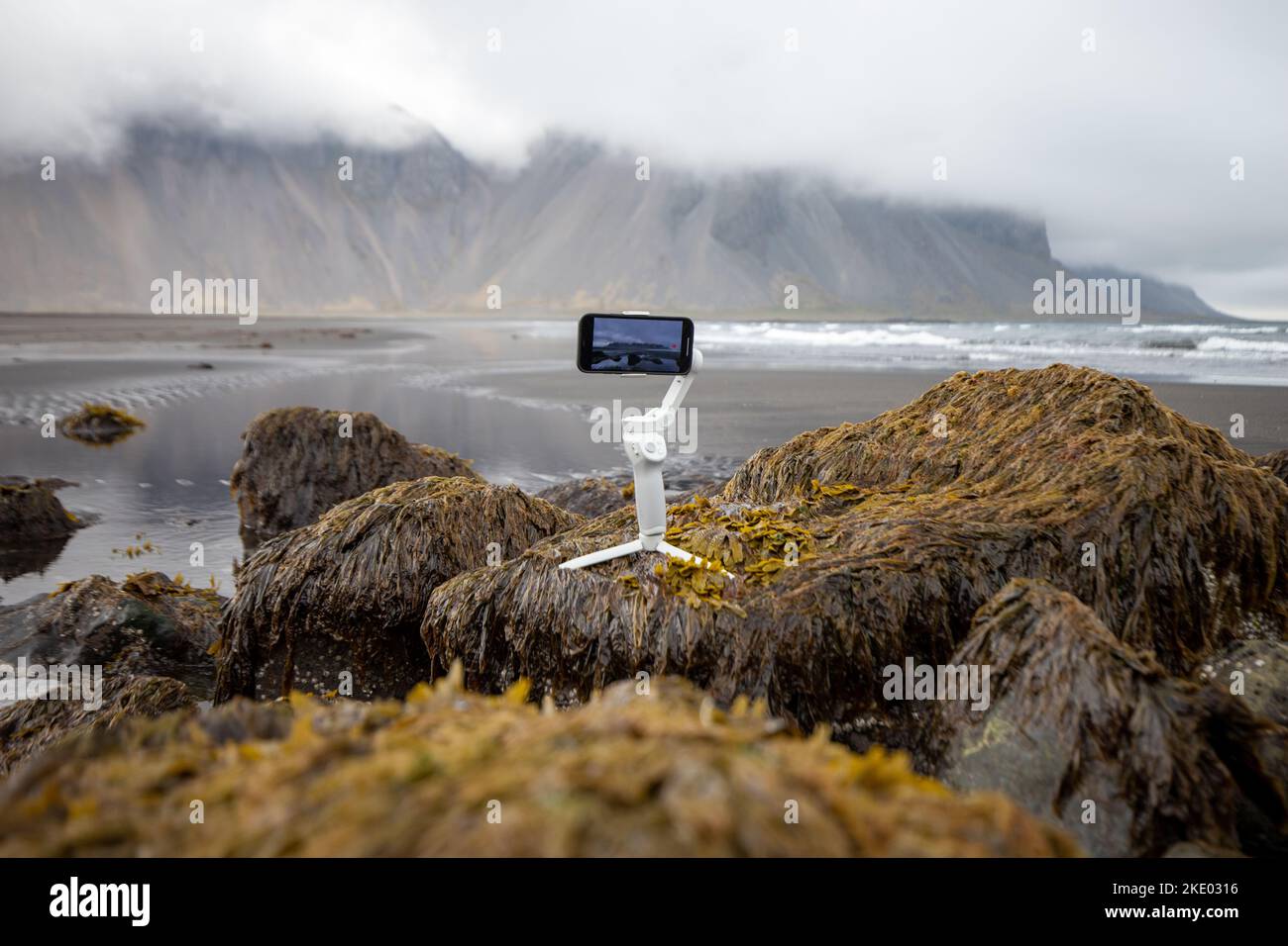 The Smartphone Gimbal on Stockness Beach in Iceland with mountains in ...