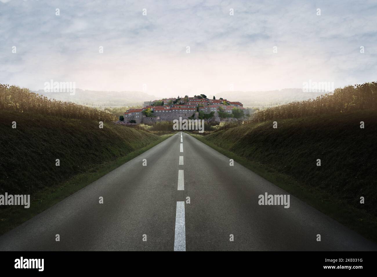 A highway tiled road with grasses by it sides Stock Photo - Alamy