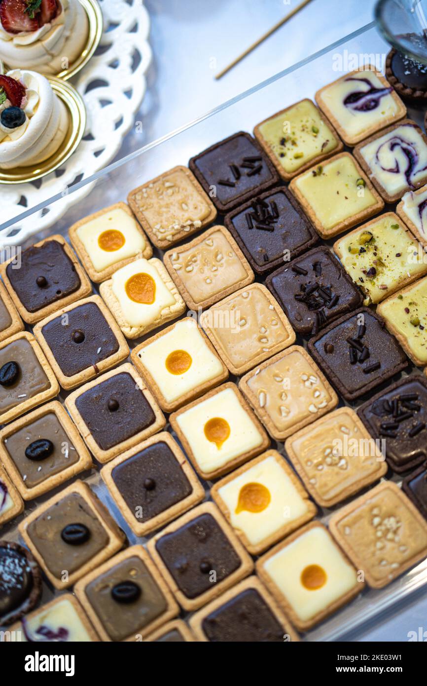 Delicious wedding reception candy bar dessert table with various sweets ...