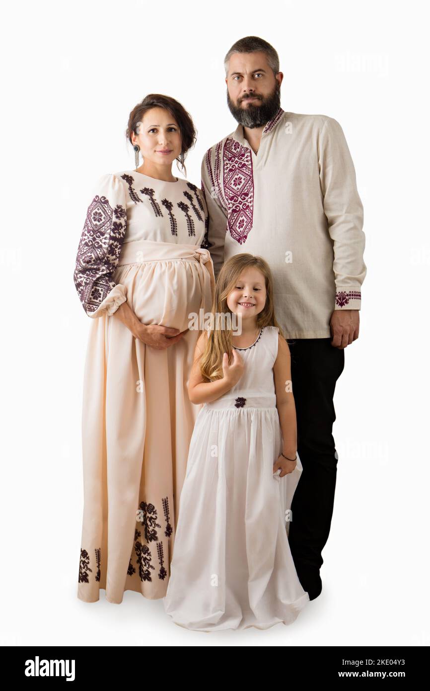 Ukrainian family of pregnant mother, father and daughter in traditional ...
