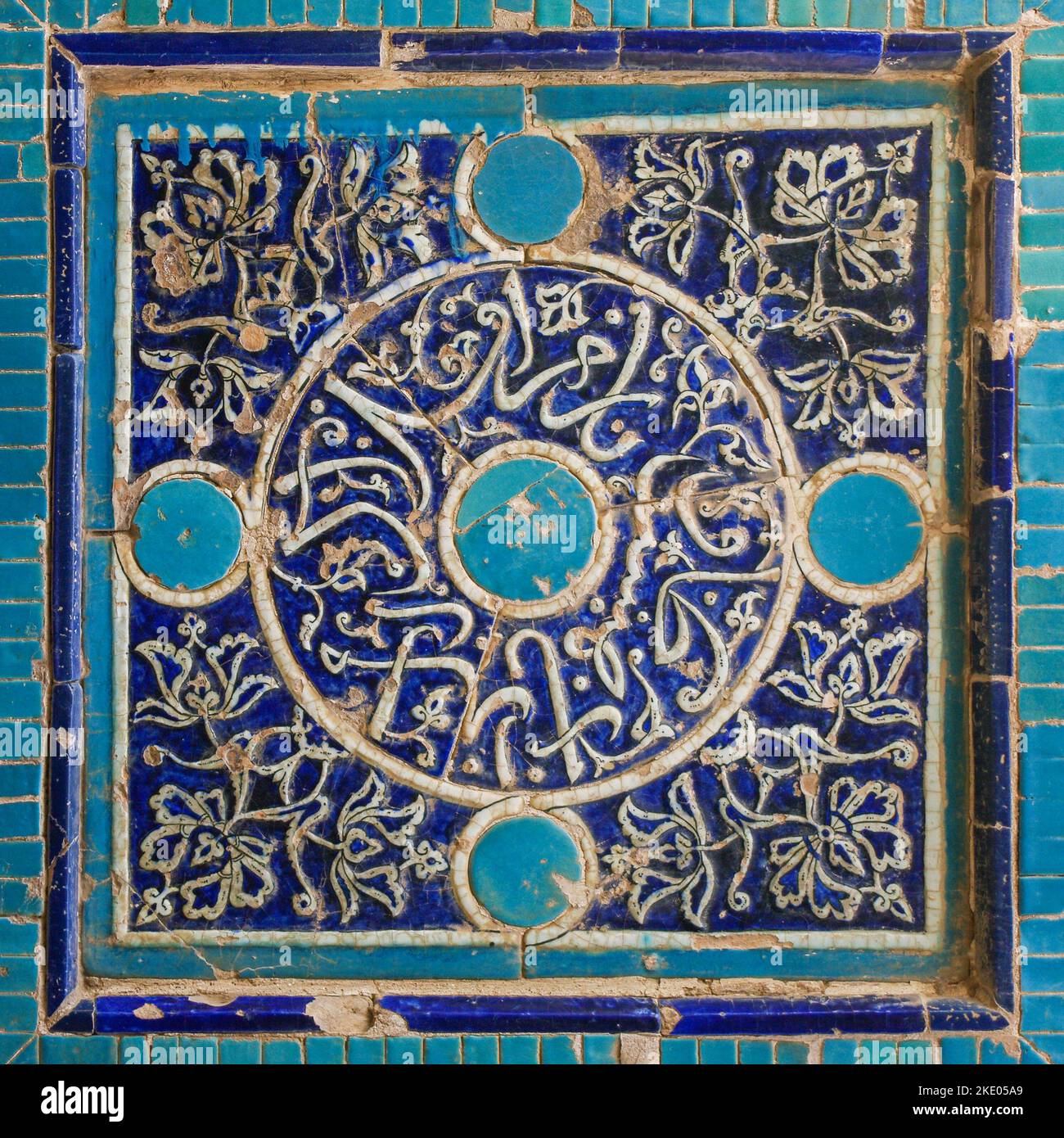 Floral and geometric blue and turquoise tile decoration on wall of ...