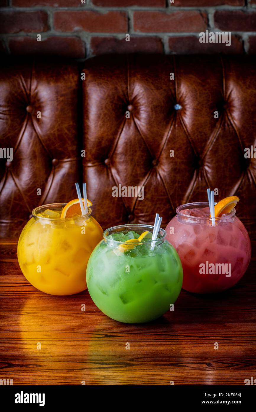 A closeup shot of colorful cocktails in round jars Stock Photo - Alamy