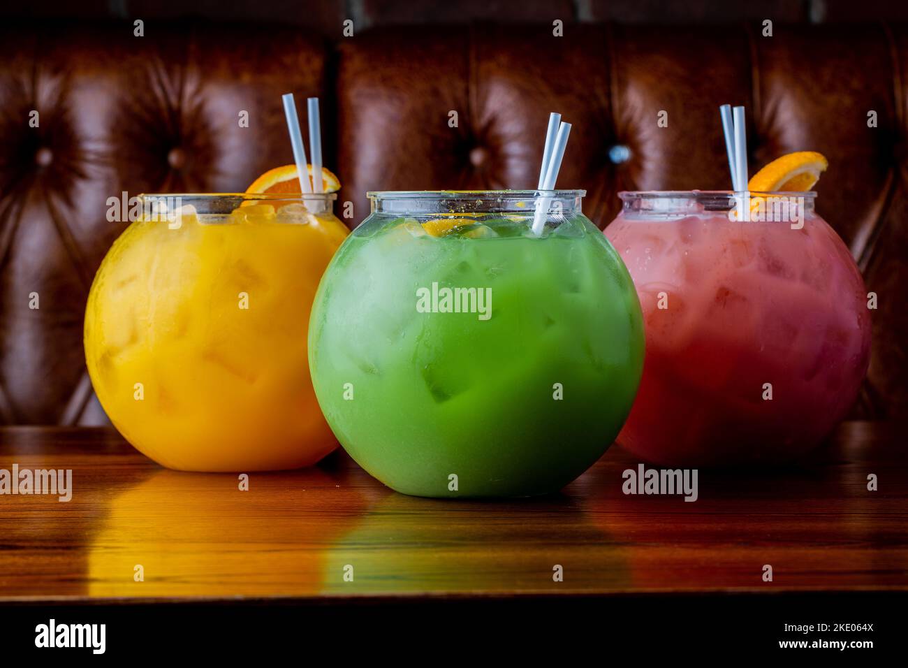 A closeup shot of colorful cocktails in round jars Stock Photo - Alamy