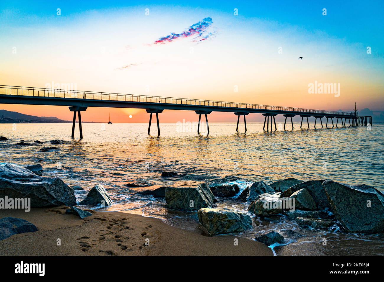 A sea pier on a sunset Stock Photo - Alamy
