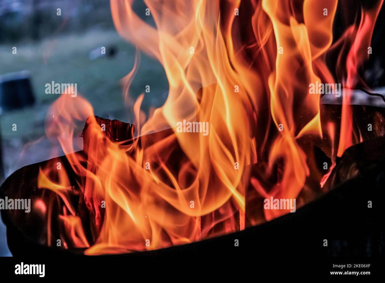 A closeup of glowing fire flames on a blurred background Stock Photo ...