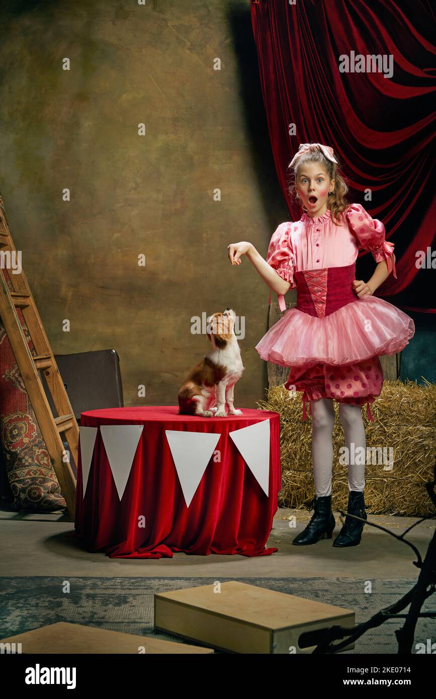 Circus trainer. Portrait of little cute beautiful girl in festive dress ...
