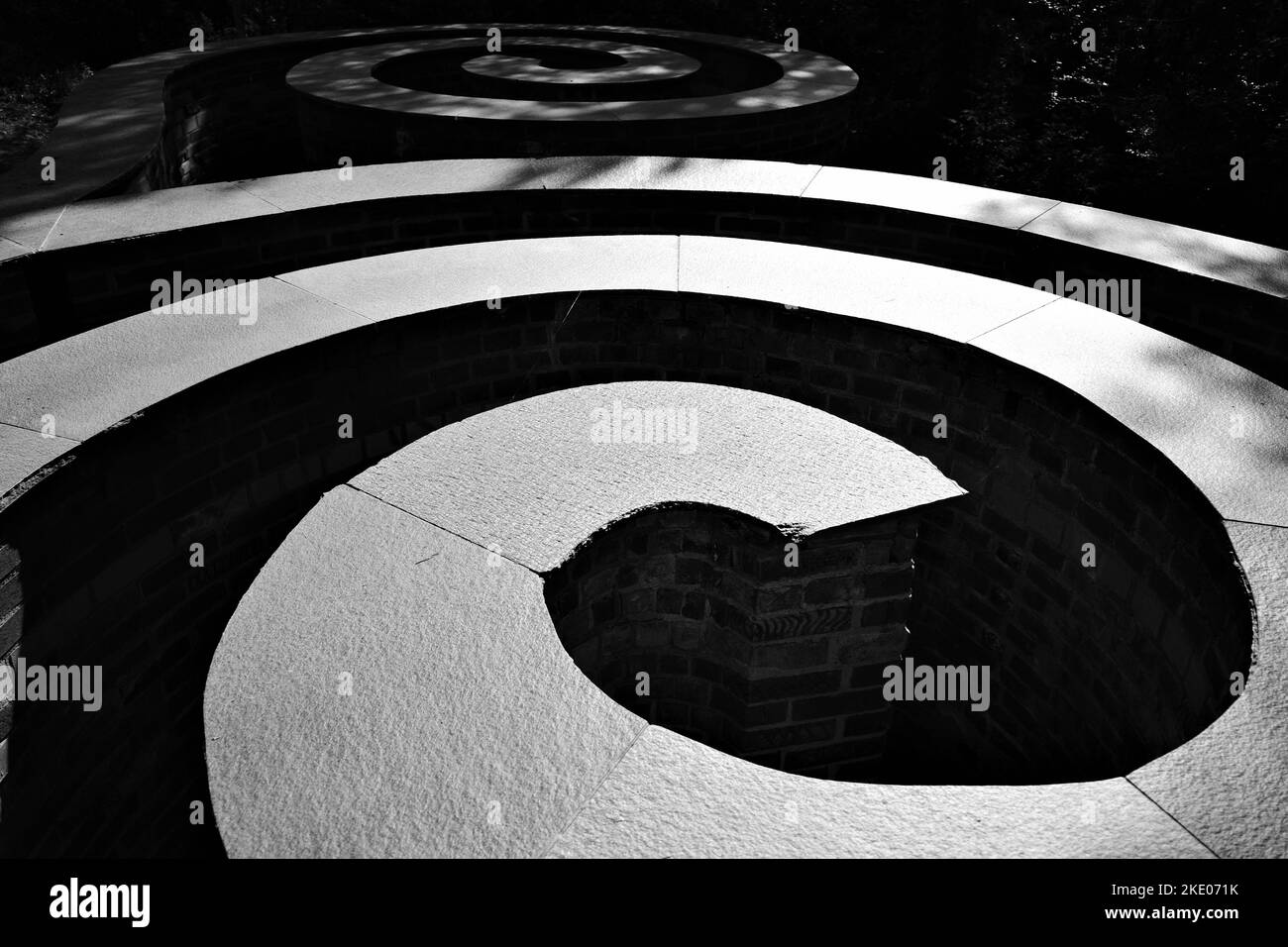 A monochrome shot of the round labyrinth in the landscape Stock Photo ...