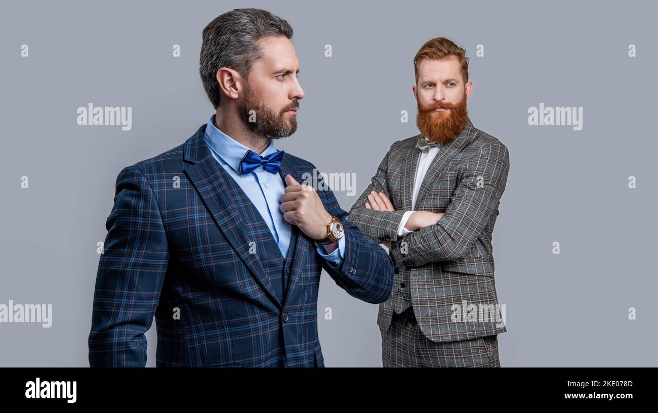 studio shot of men wearing bowtie and tux, selective focus. elegant men ...