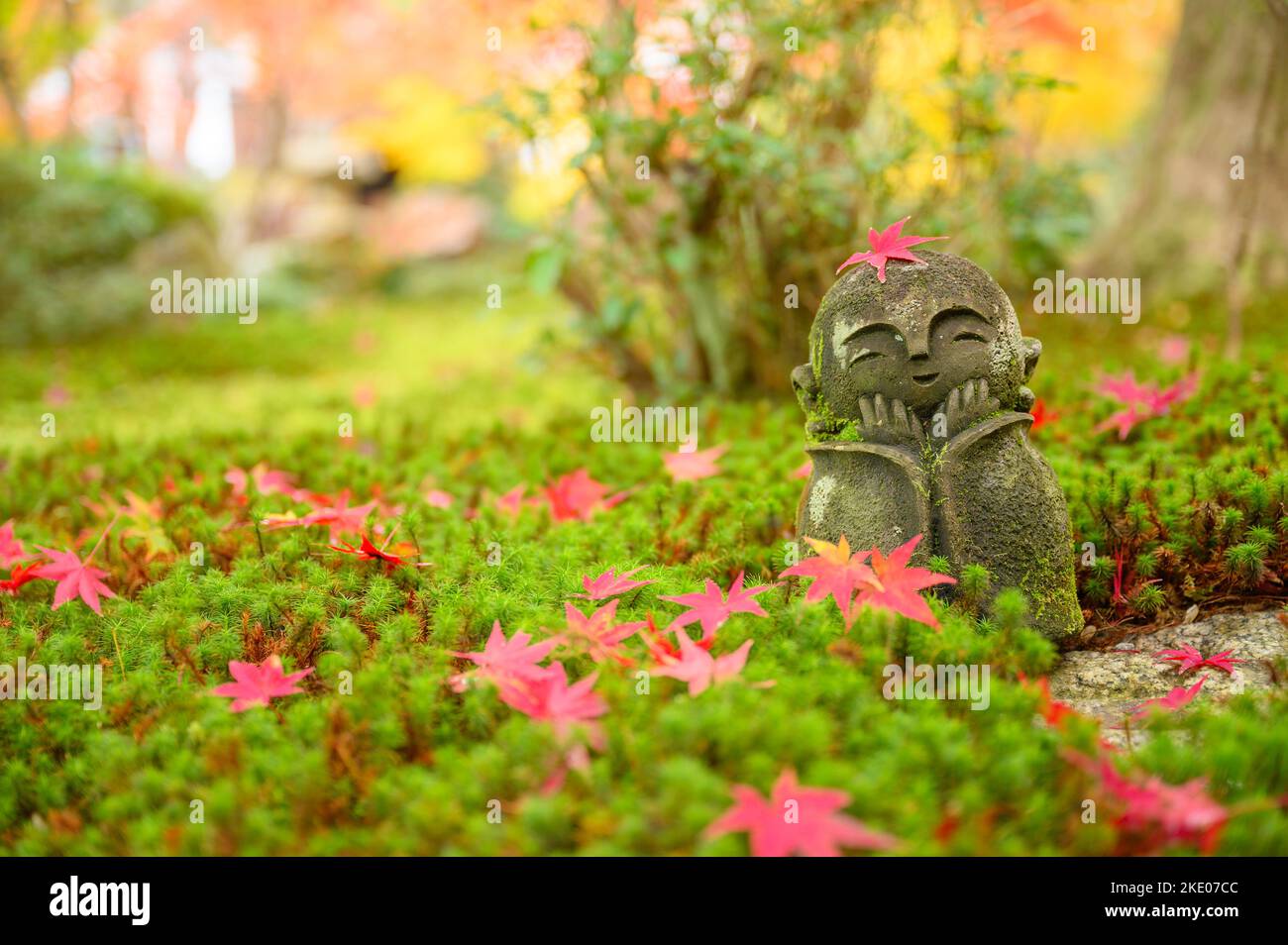 The Maple leaves on the head of Jizo sculpture doll in a Japanese ...