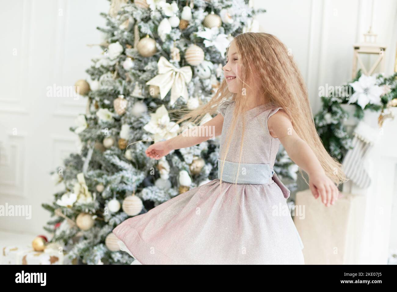 Happy excited girl child holding christmas gift box. Happy little girl ...