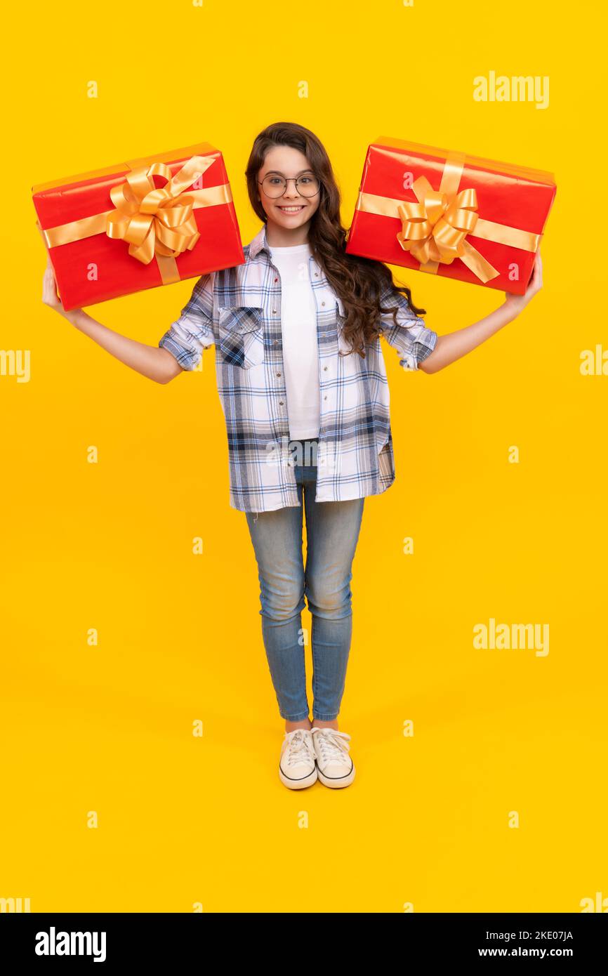 smiling teen kid holding box of present. teen kid with present isolated ...