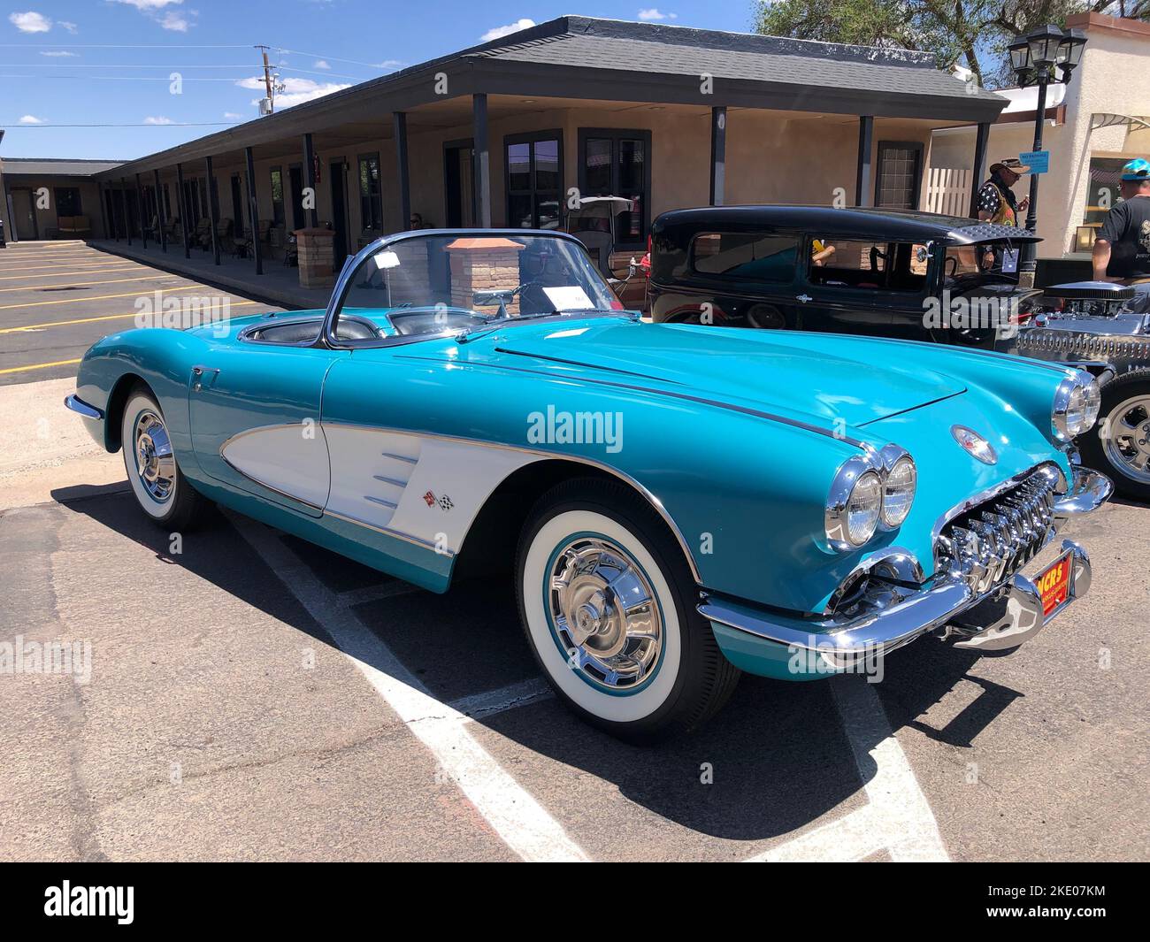A beautiful classic blue Chevrolet Corvette on the road during a car ...