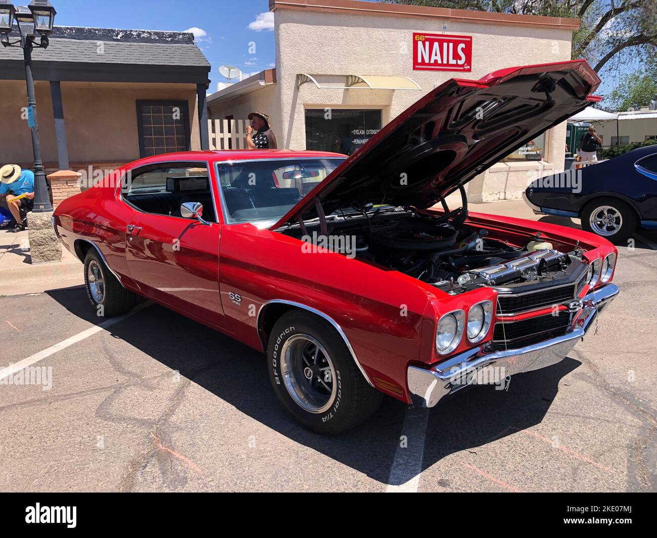 A beautiful classic red Chevrolet Chevelle with an open hood on the ...