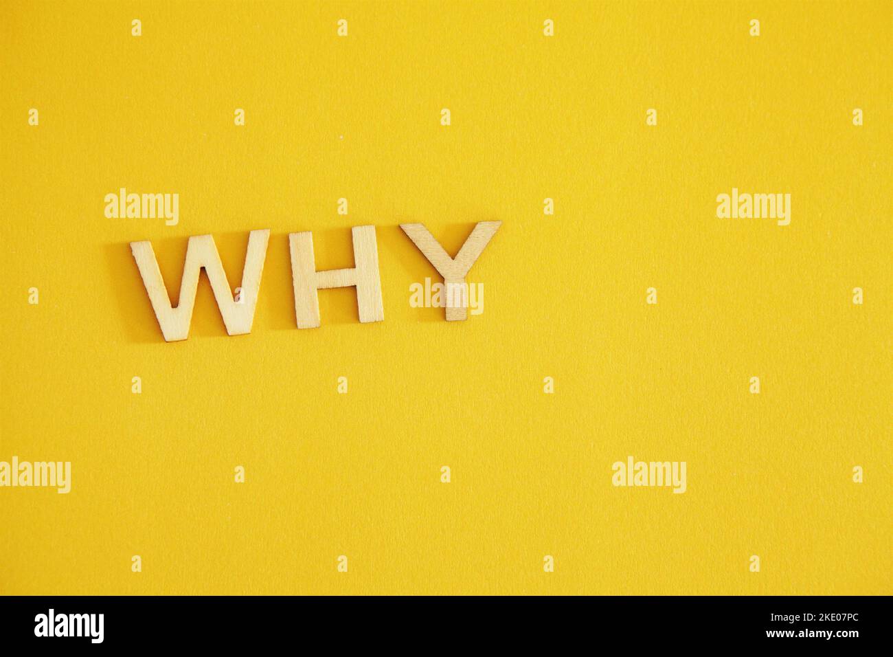 A postcard Why text on a yellow background with copy space Stock Photo ...