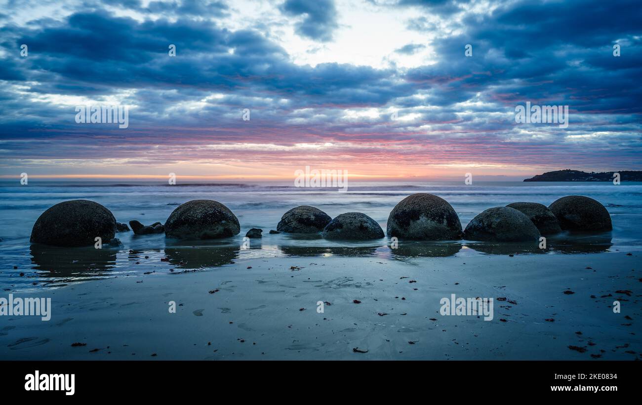 A scenic view of Moeraki Boulders Beach in Hampden, New Zealand at ...