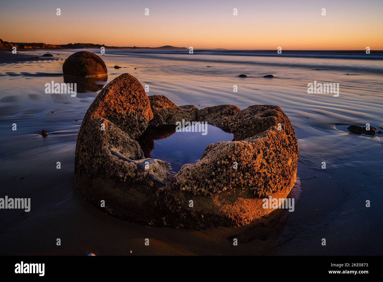 A scenic view of Moeraki Boulders Beach in Hampden, New Zealand at ...