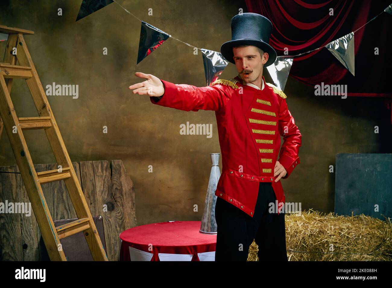 Vintage portrait of male retro circus entertainer expresses rejoice and ...