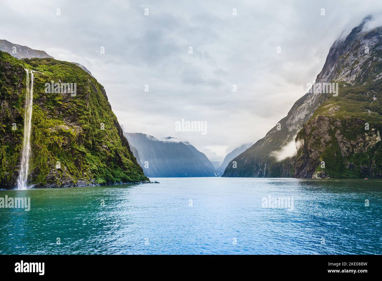 An aerial view of lake surrounded by rocky greenery mountains Stock Photo - Alamy