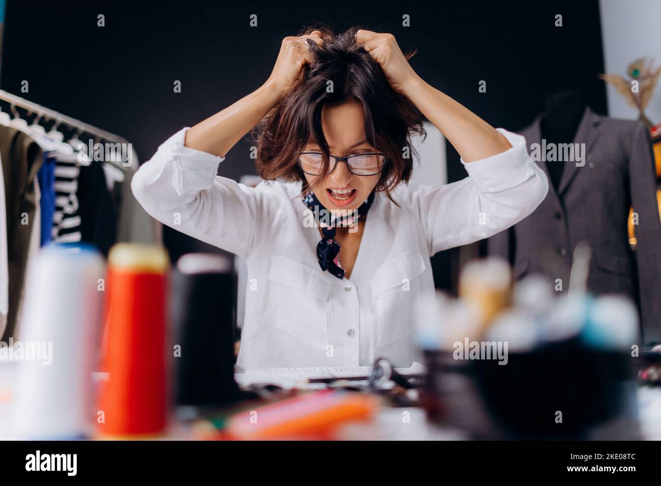 Angry designer at atelier Stock Photo - Alamy