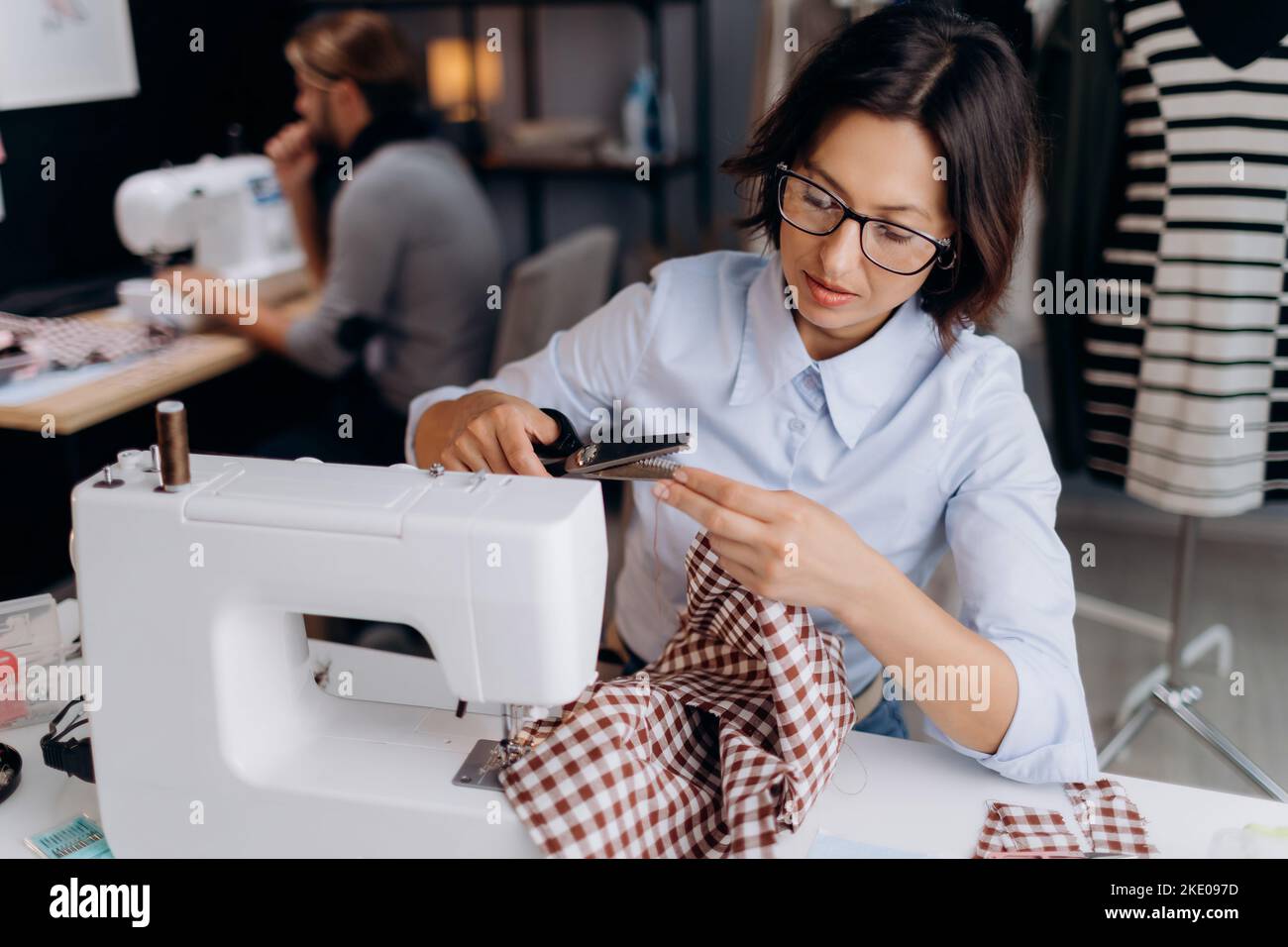 Seamstress working on sewing machine hi-res stock photography and ...