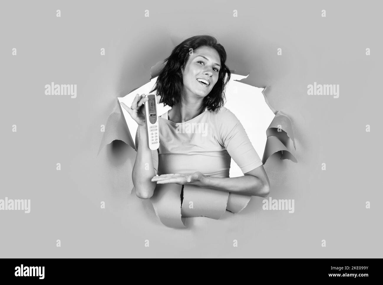 best device for you. happy woman showing remote control. cheerful ...