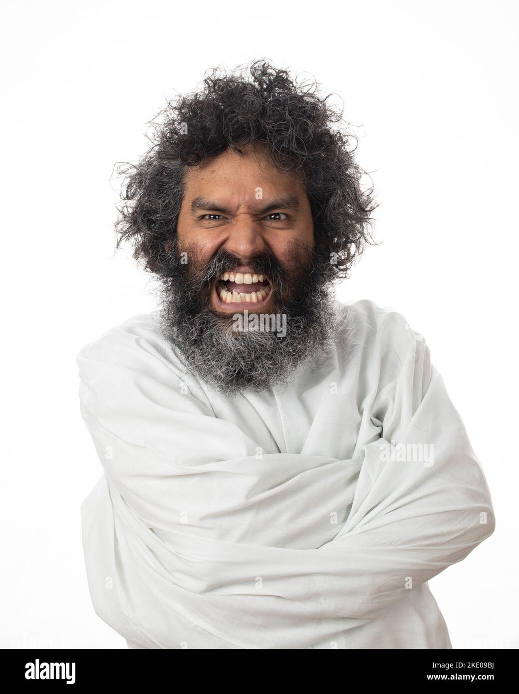 A crazy man expressing anger and discomfort in a straitjacket - the ...