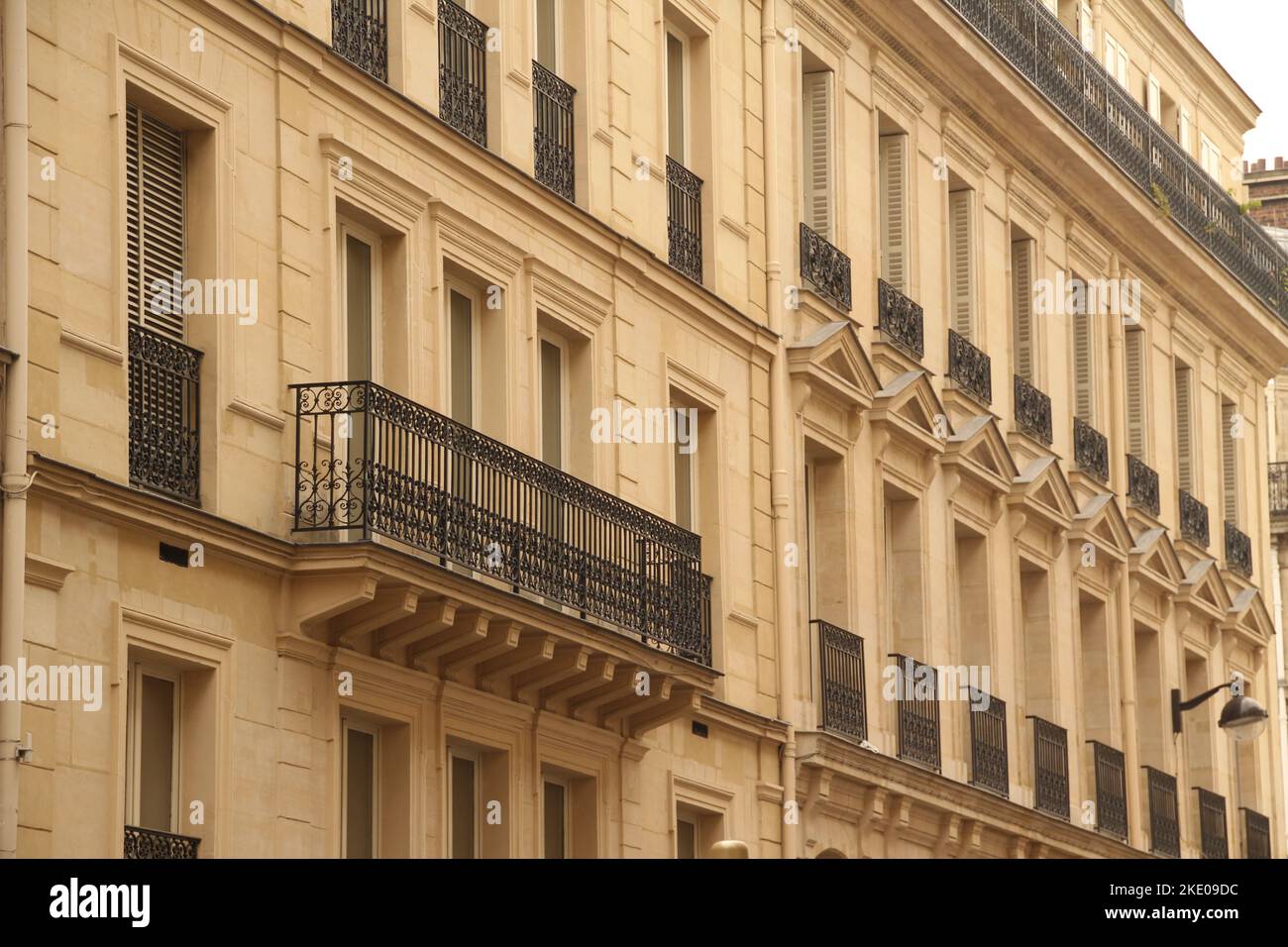 A close-up of a building facade with long narrow windows Paris, France ...