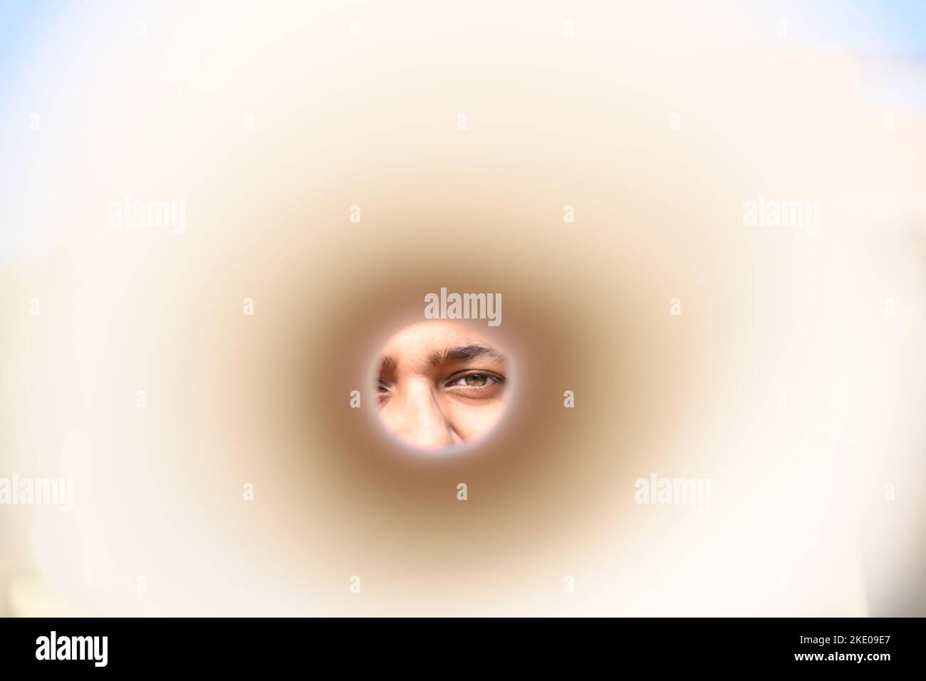 Viewing through a paper roll Stock Photo - Alamy