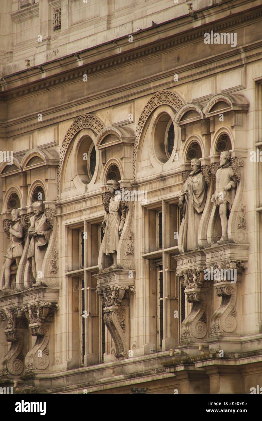 A vertical shot of a building facade with sculptures, Paris, France ...
