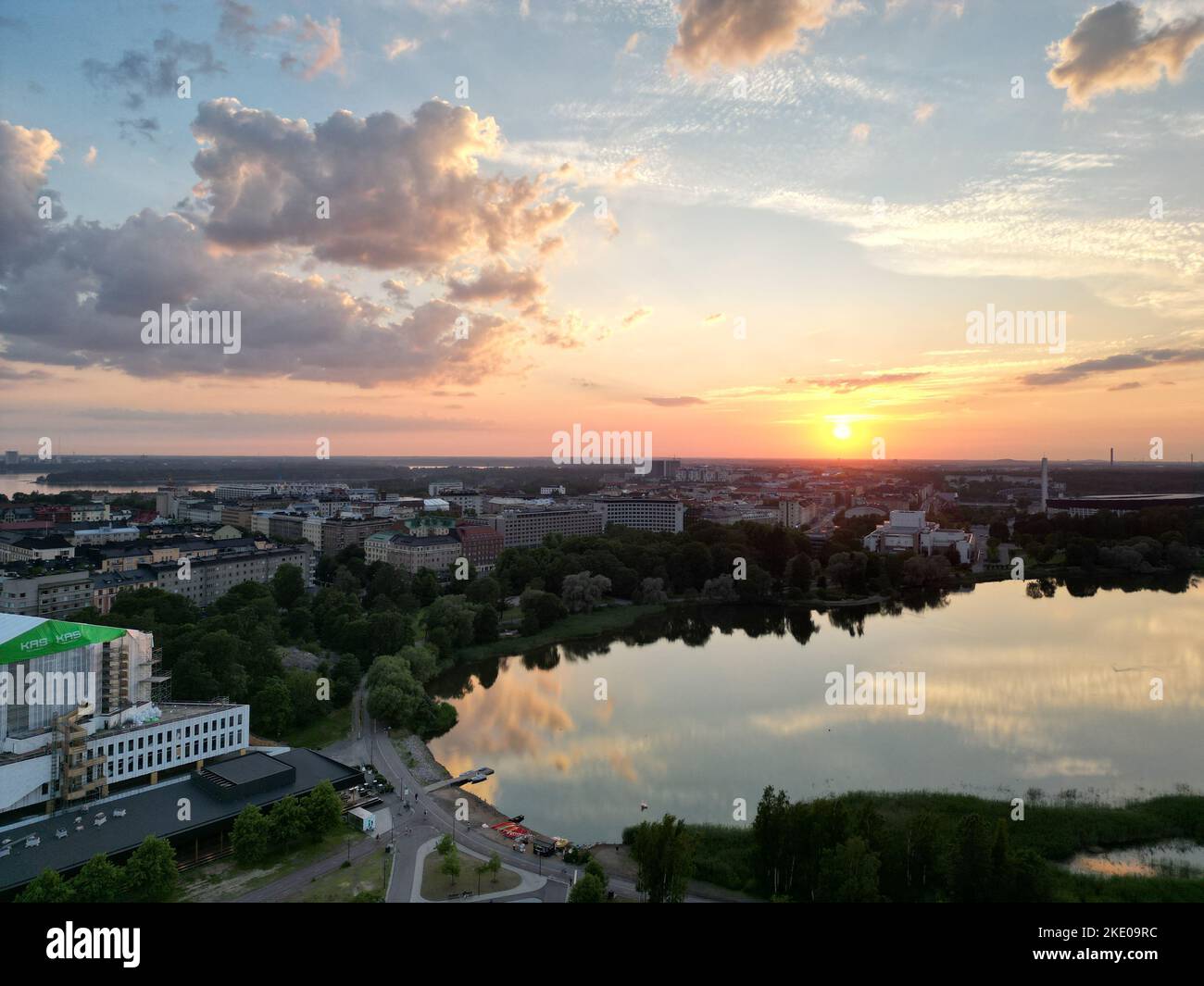 An aerial shot of Helsinki city center and Toolo Bay during a sunset ...