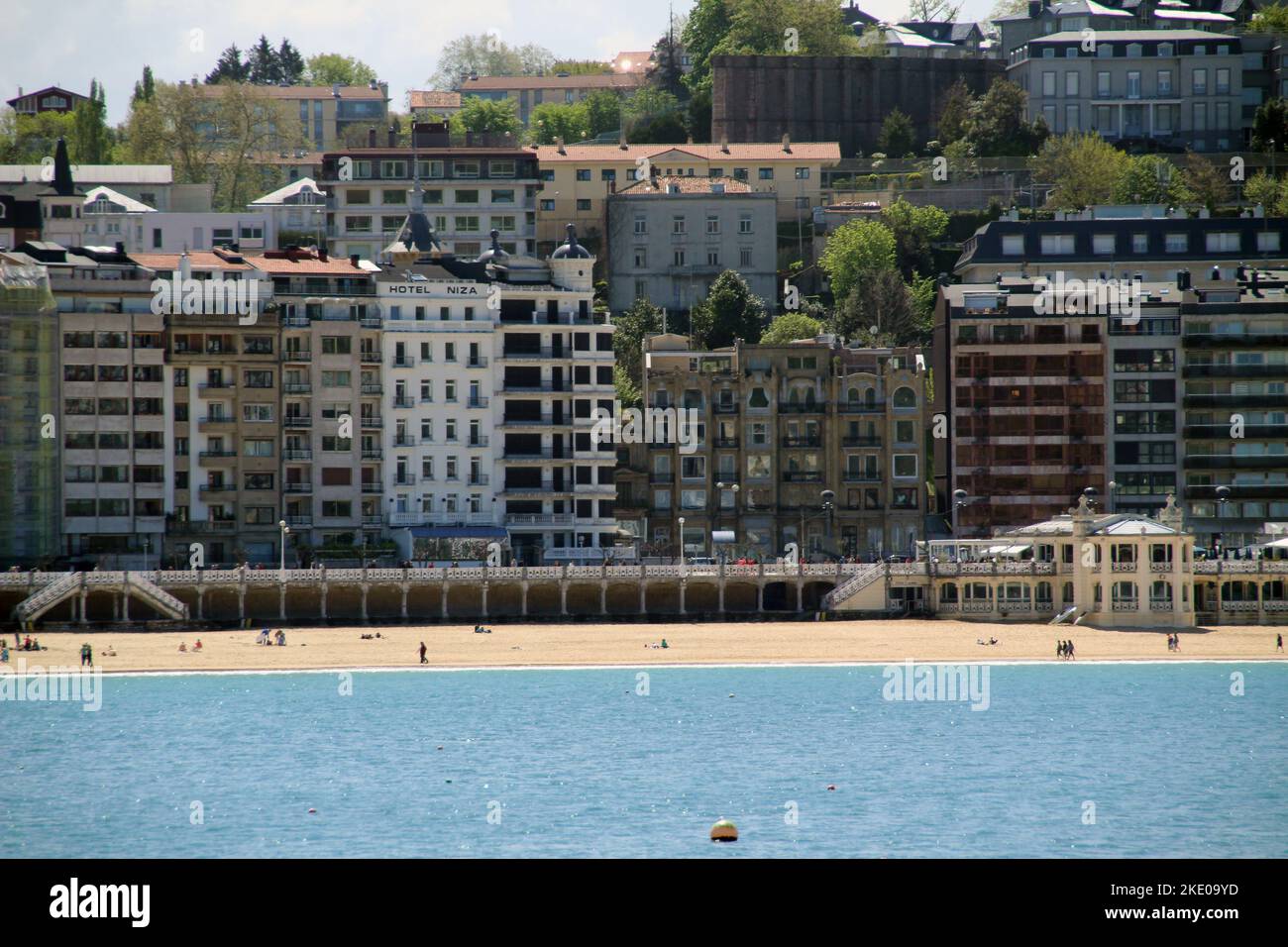 The landscape of the buildings of San Sebastian city at the shore on a ...