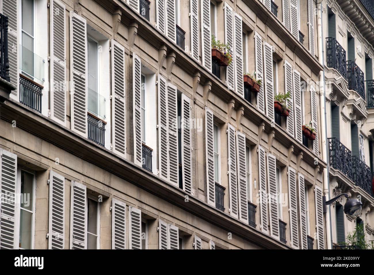 A close-up of a building facade with narrow long windows, Paris, France ...