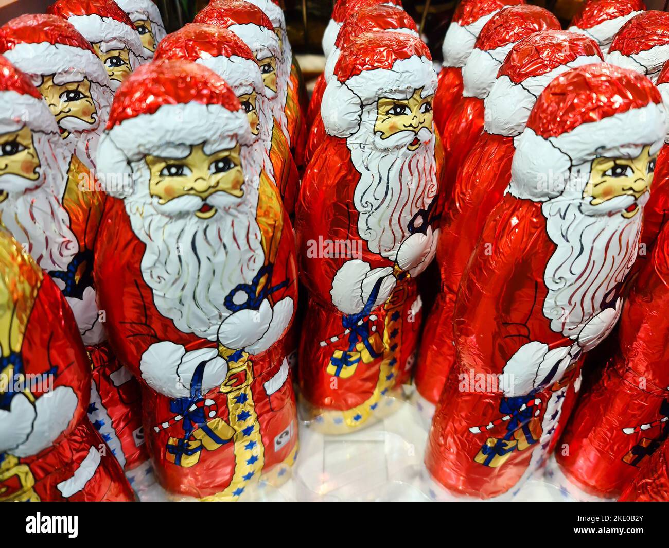 The numerous colorfully wrapped chocolate Santas in a supermarket for ...