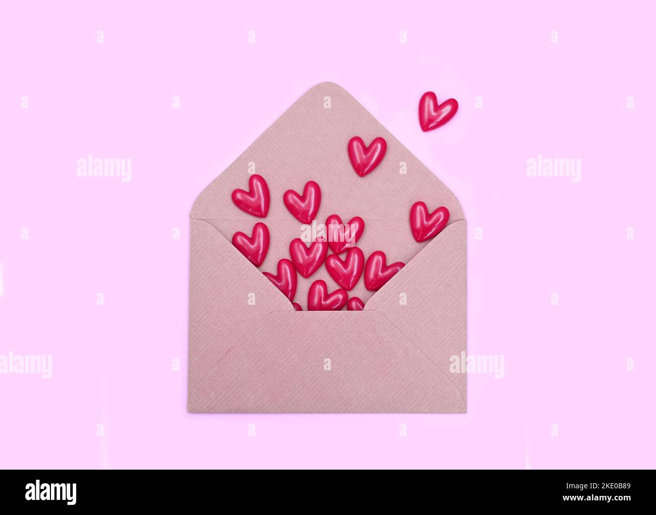 Envelope and red hearts on pink background. Valentine's day, love ...