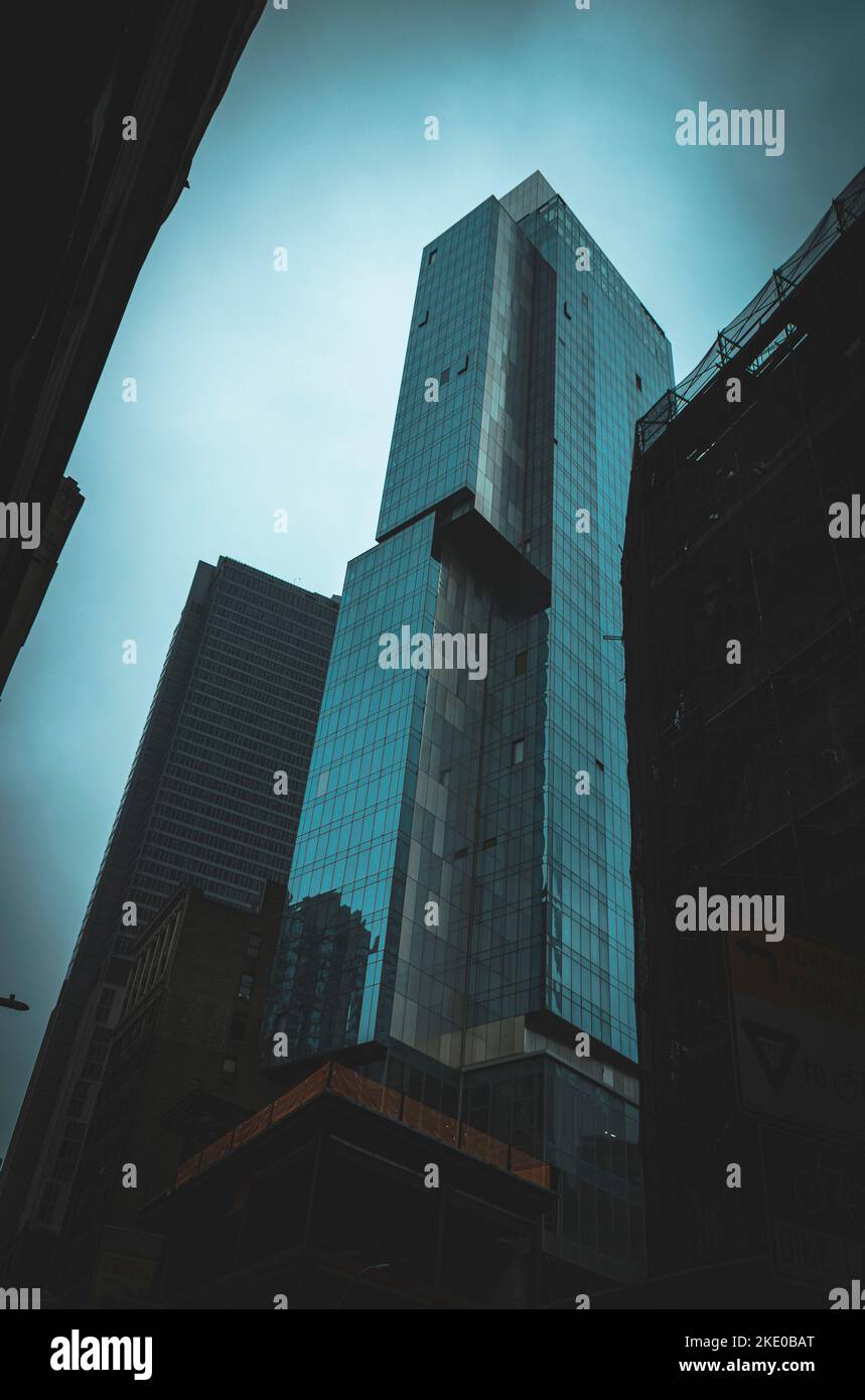 A low-angle vertical skyscraper against a clouded sky Stock Photo - Alamy