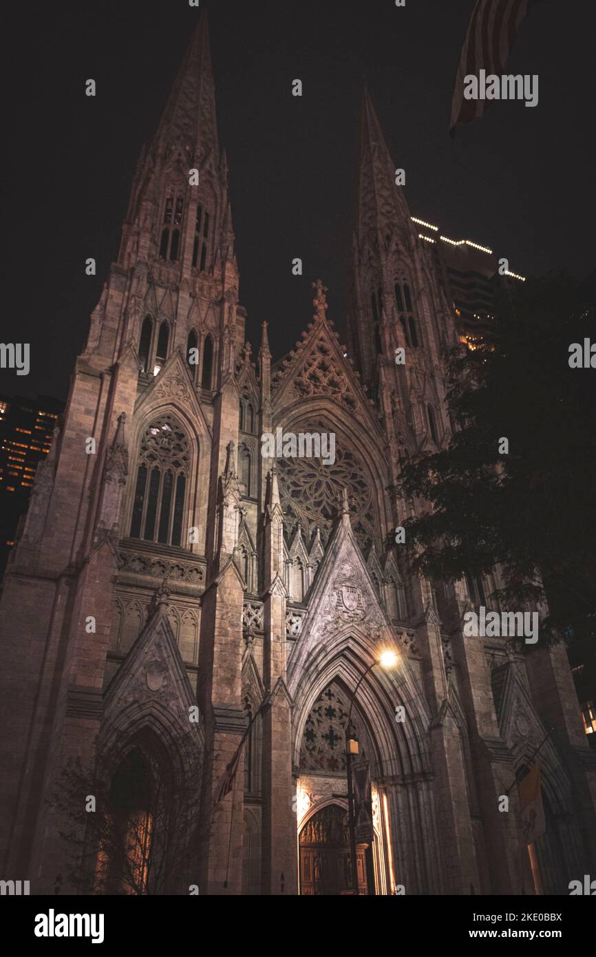 A low-angle vertical shot of the Cologne Cathedral in Germany at night ...