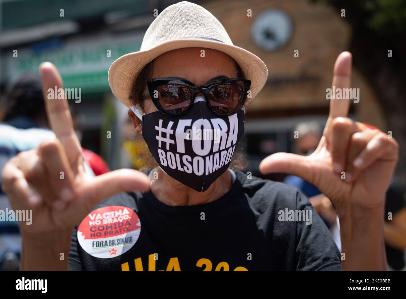 A male with glasses and a hat at the protest Stock Photo - Alamy