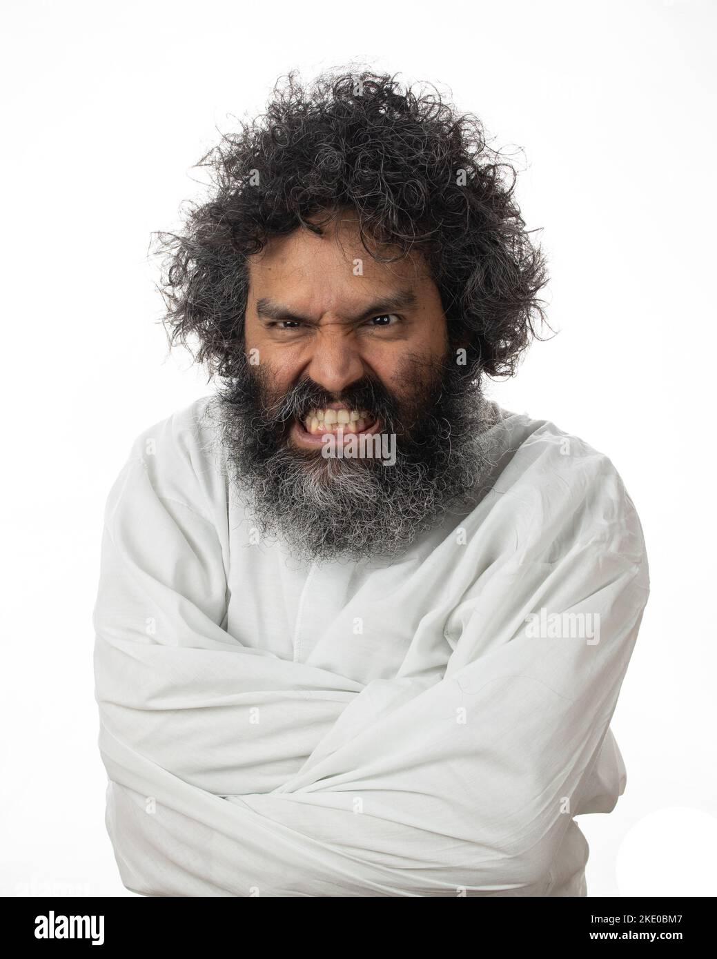 A crazy man expressing anger and discomfort in a straitjacket - the ...