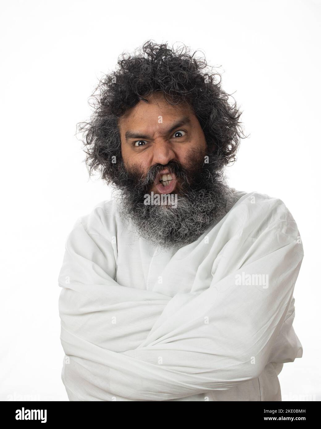 A crazy man expressing anger and discomfort in a straitjacket - the ...