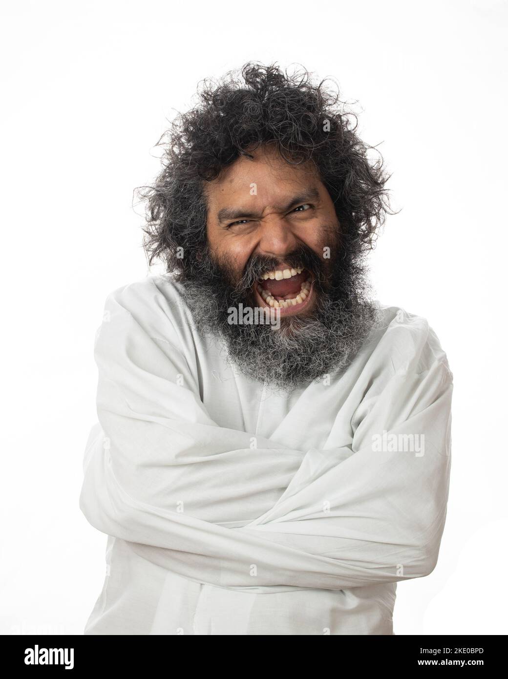 A crazy man expressing anger and discomfort in a straitjacket - the ...