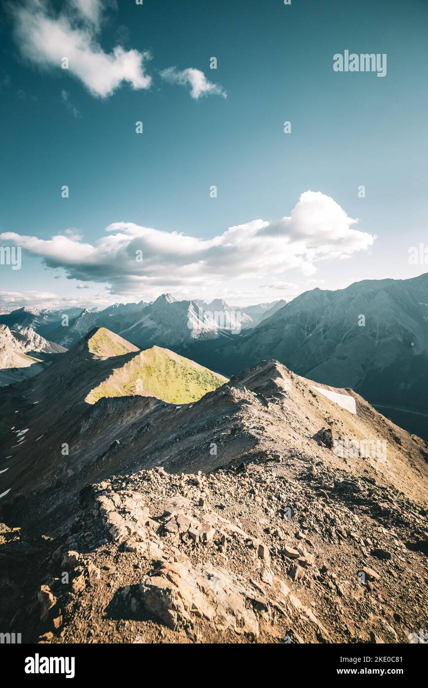 A vertical shot of mountains against the background of the blue sky ...