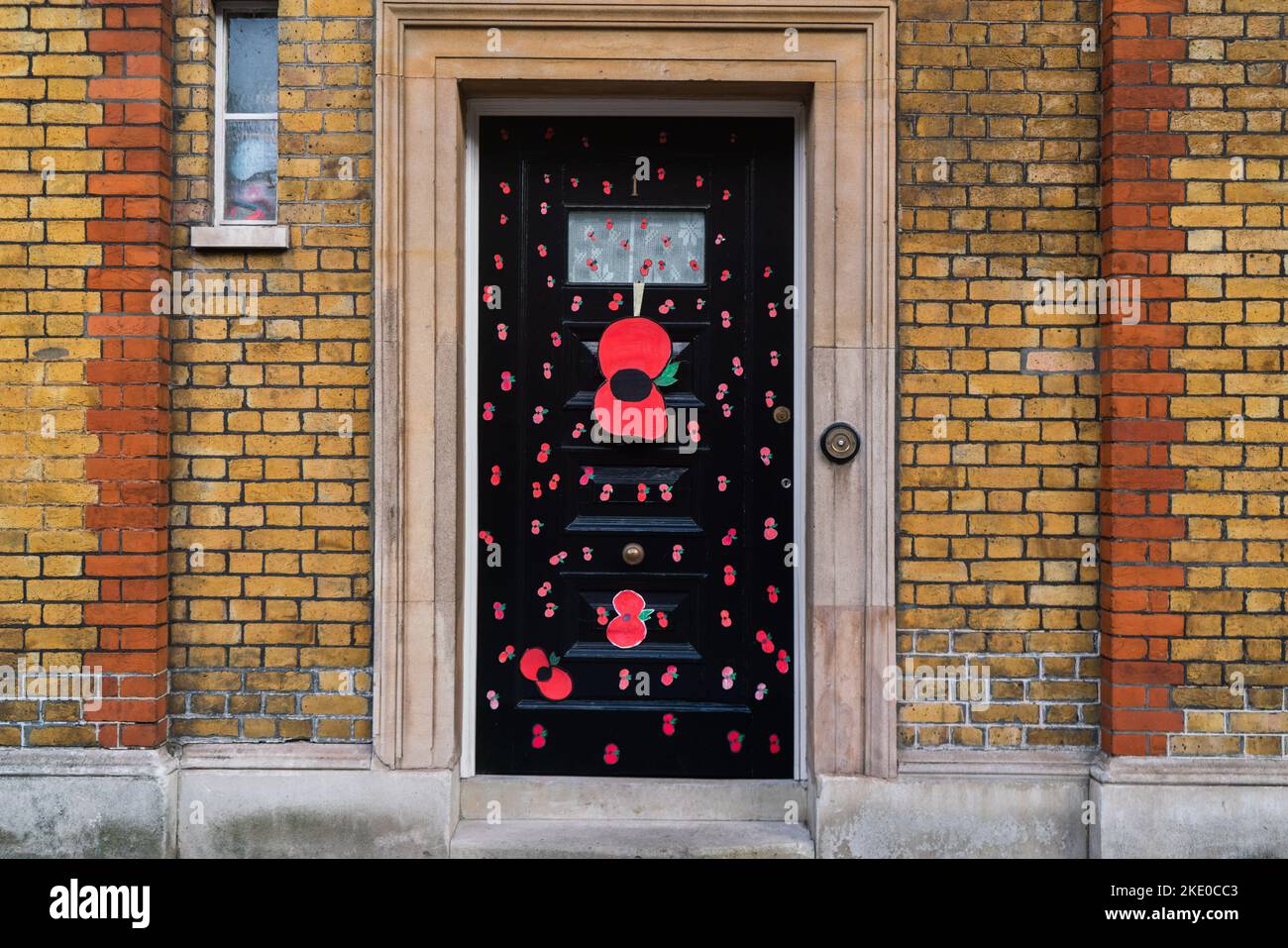 9 November 2022. House door decorated with remembrance poppies, London ...