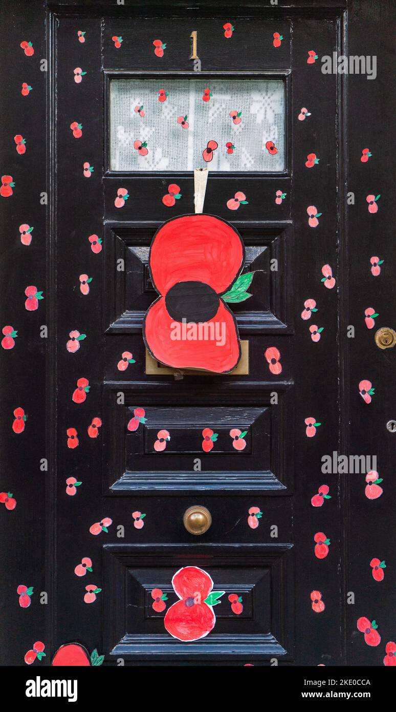 9 November 2022. House door decorated with remembrance poppies, London ...