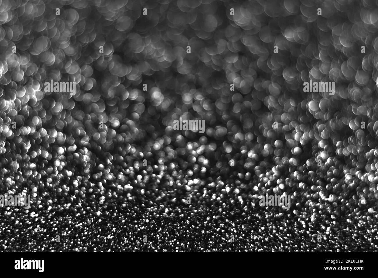 Gray black sparkling glitter bokeh background, abstract defocused ...