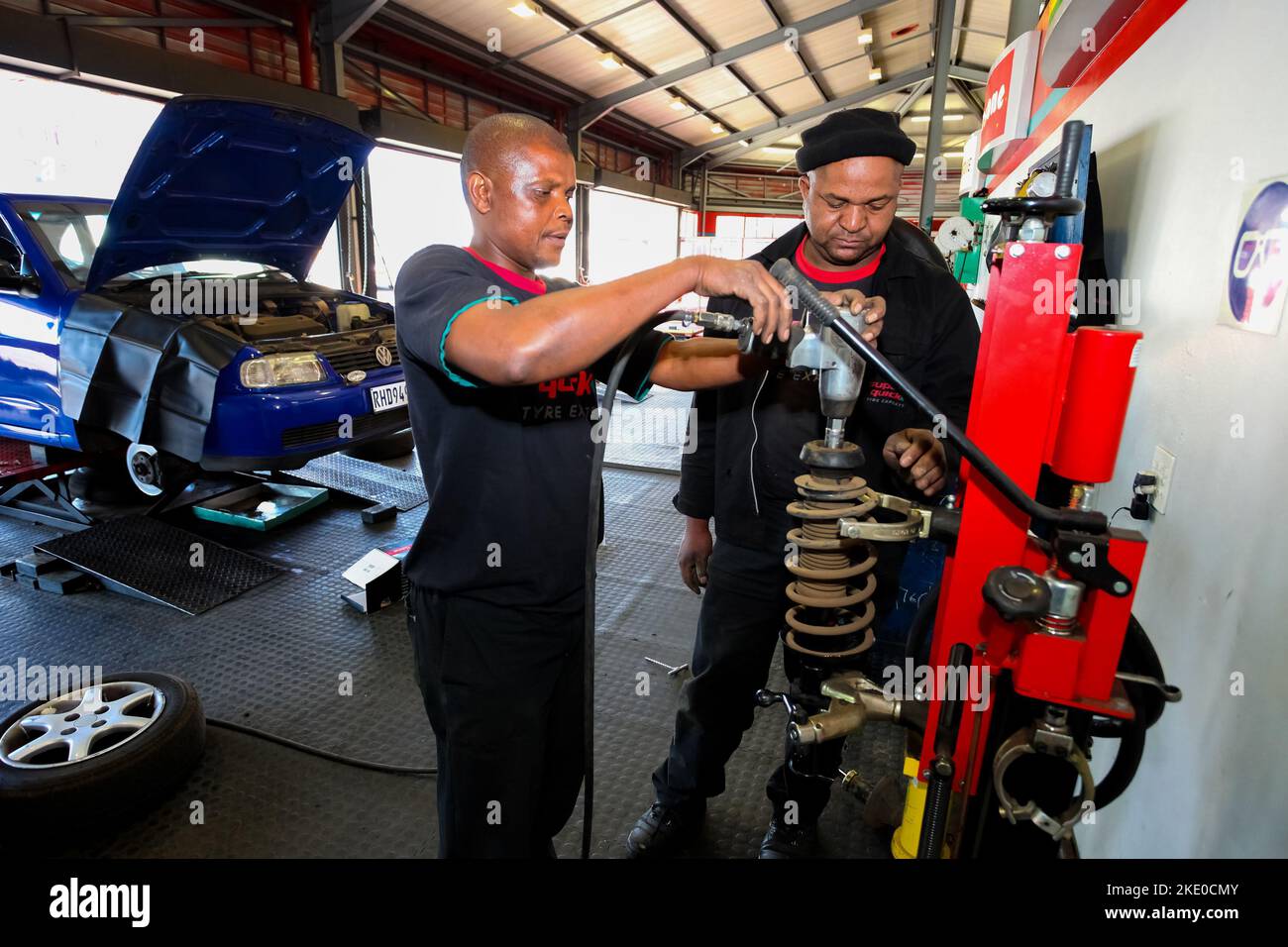 The male workers at a tire repair and wheel alignment service center in ...