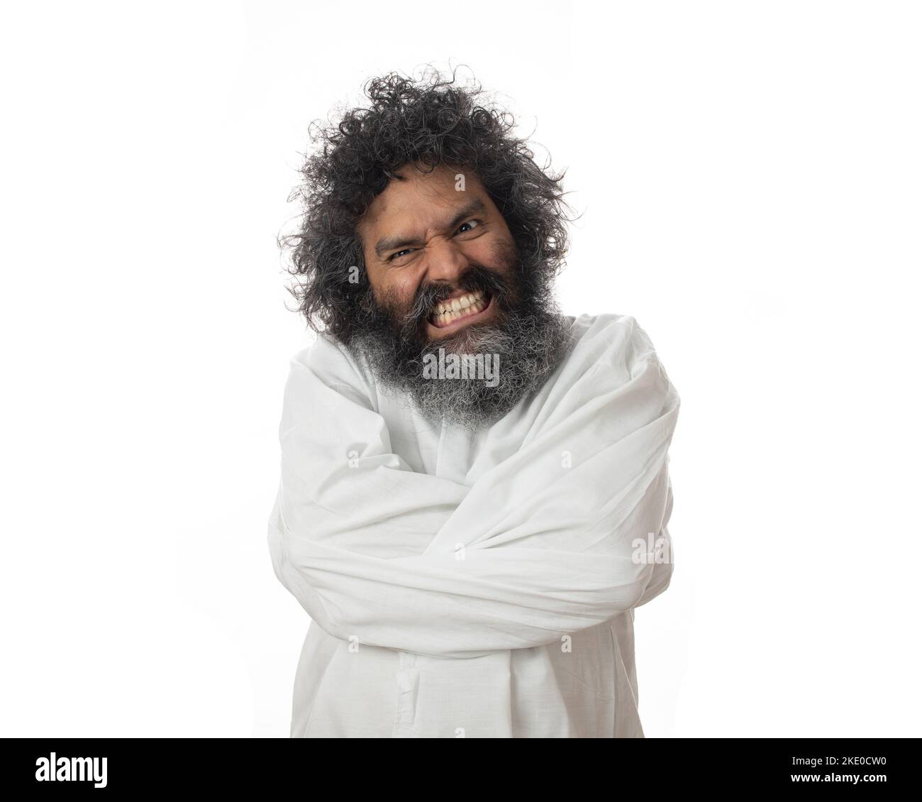 A portrait of a mental man going crazy with rage in a straitjacket on a ...