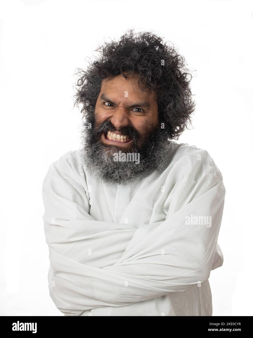 A vertical shot of a male psychopath grinding teeth in a white ...