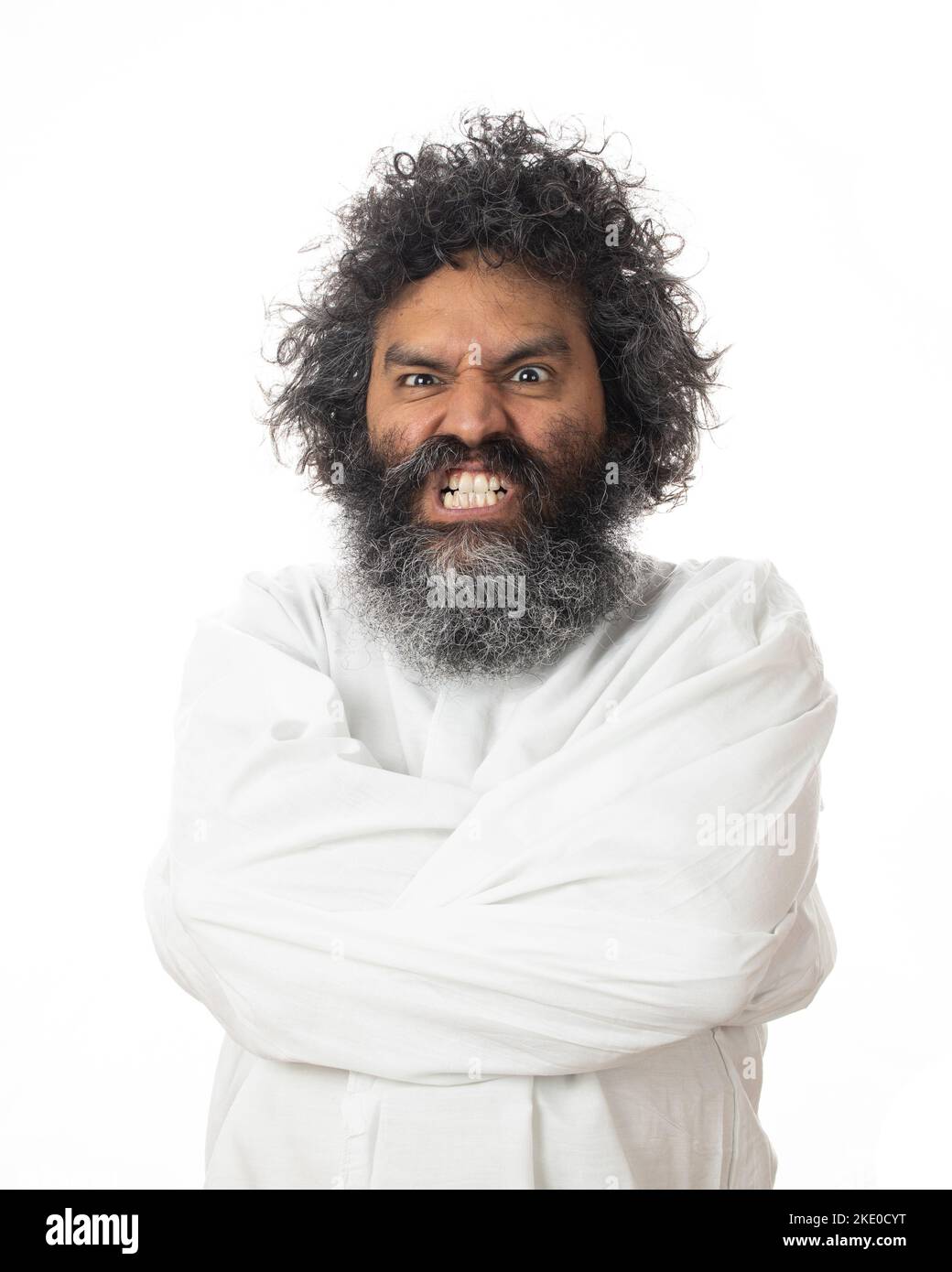 A vertical shot of a male psychopath with a beard grinding teeth in a ...